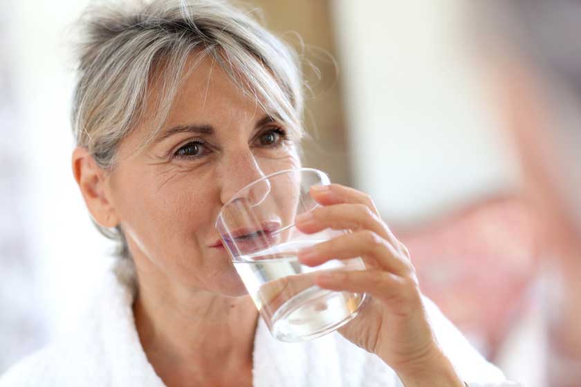Senior woman drinking water | Morada Senior Living